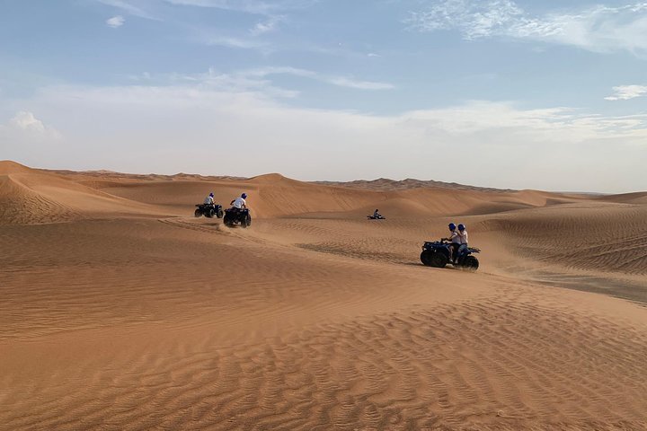 Dubai: Unique SUNSET Quad Bike Red Dunes Safari