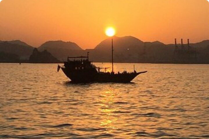 Omani Traditional Dhow Cruise: Sunset and Muscat Coastal View